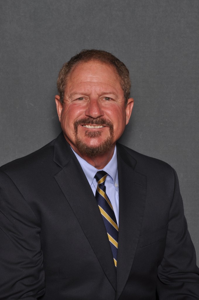 Trachier Transitions Into Full-Time Coach – Thomas T. Moore